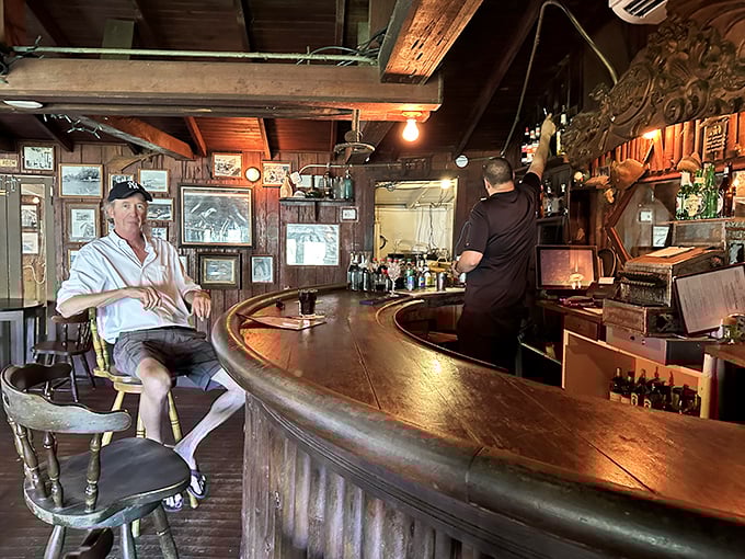 The curved wooden bar has witnessed decades of toasts, first dates, and fishing tales that grow more impressive with each retelling.