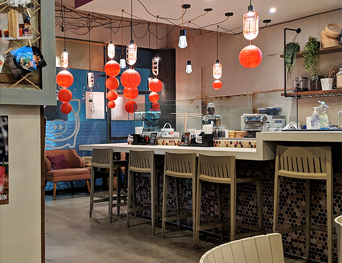 The bar area, adorned with lanterns and warm lighting, invites lingering conversations. Suddenly, "just one more dish" becomes the evening's mantra.