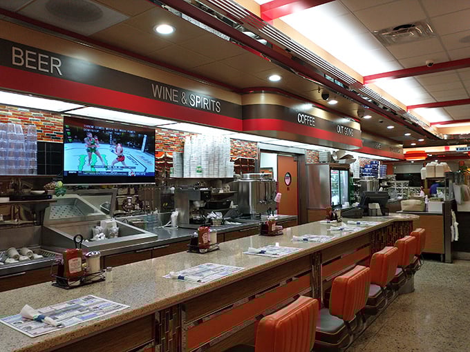 The counter seating offers front-row seats to the culinary theater where breakfast dreams become delicious reality.