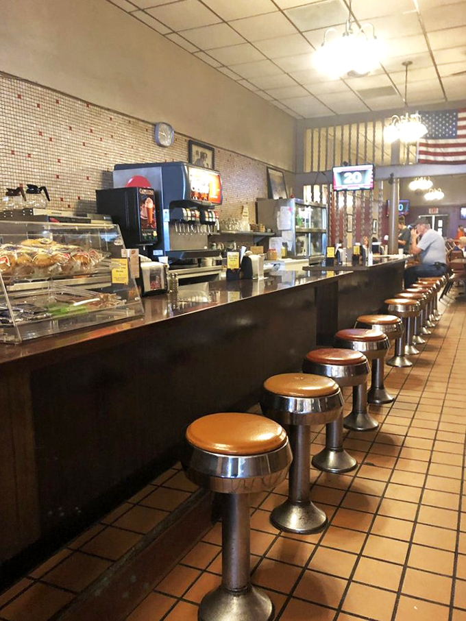 The classic diner counter invites conversation and community, where strangers become friends over shared meals and stories.