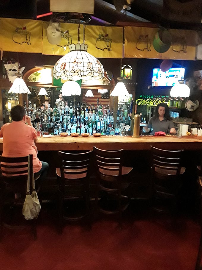 A bar that says, "Pull up a seat, friend—we've been expecting you," with enough bottles to solve or create life's problems.