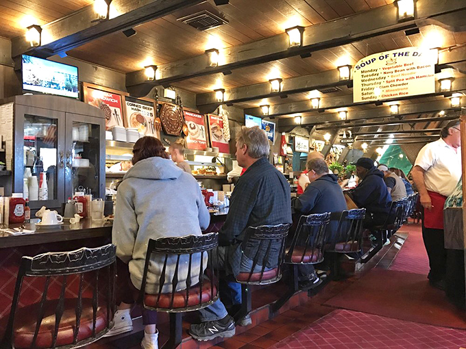 The counter seating—where solo diners become regulars and servers remember your order before you sit down. Pure diner magic in action.