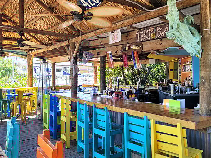 The tiki bar's vibrant chairs form a color palette that screams "you're in Florida now" – subtle is for other states.