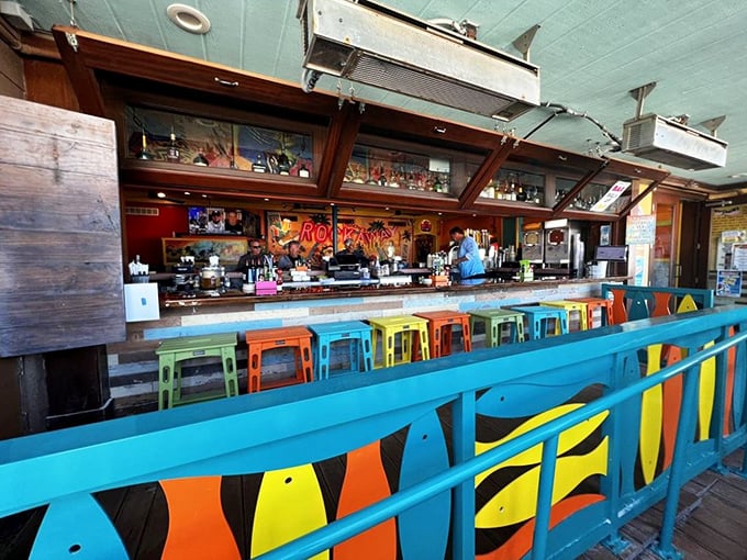Bar none, the best seats in the house. This colorful lineup of stools invites you to belly up for cold drinks and hot gossip while watching bartenders work their magic.