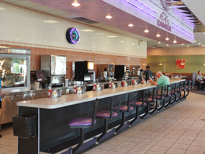 The counter—where solo diners find community and the coffee is always within arm's reach. Diner choreography at its finest.