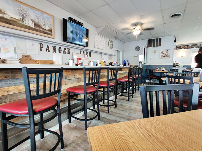 More than just a counter—it's breakfast theater where regulars have favorite seats. The wooden accents and display of photos create instant belonging.