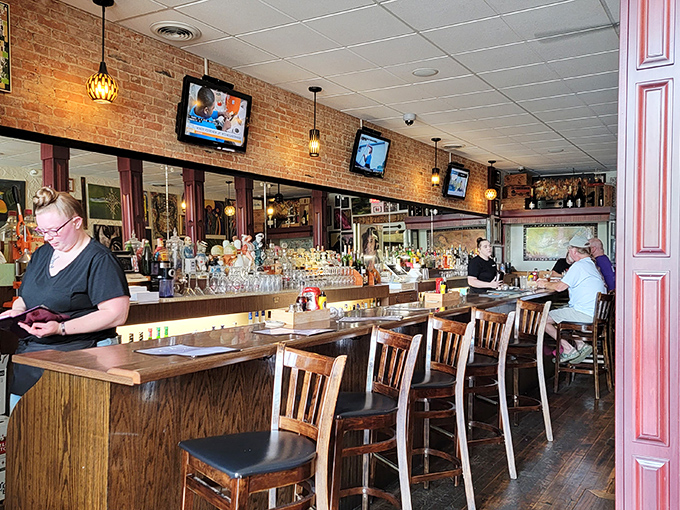 The bar at Uncle John's—where strangers become friends and friends become family. All supervised by an impressive lineup of spirits. 