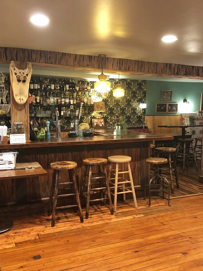 The bar area feels like it belongs in a Hemingway novel—a place where stories flow as freely as the carefully crafted cocktails.