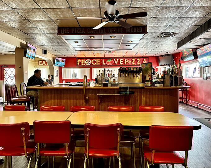 The bar area proudly proclaims "Peace Love Pizza"—three words that should really be America's unofficial national motto.