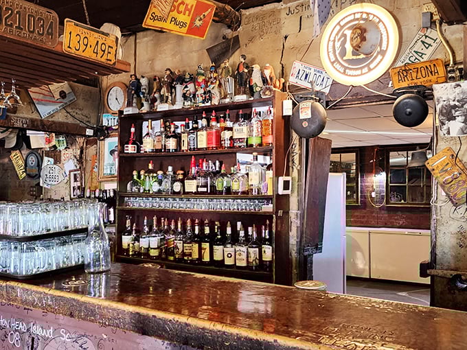 A bar that doesn't need neon signs or mixologists with waxed mustaches – just cold drinks served under the watchful gaze of vintage license plates.