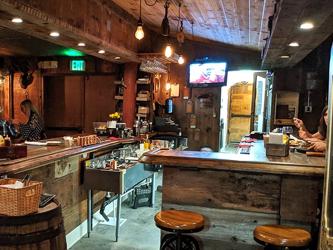 The bar area—where strangers become friends and friends become family over whiskey and tales of steaks past.
