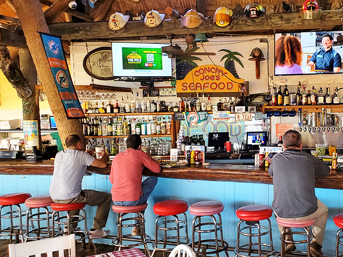 The bar at Conchy Joe's isn't trying to reinvent cocktails; it's perfecting the classics while you watch boats drift by.
