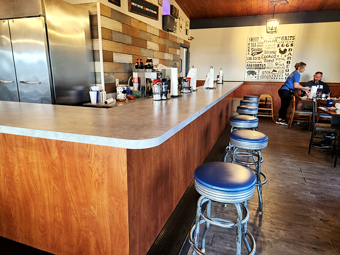Classic diner counter with chrome stools—where solo diners become regulars and servers remember your order before you sit down.