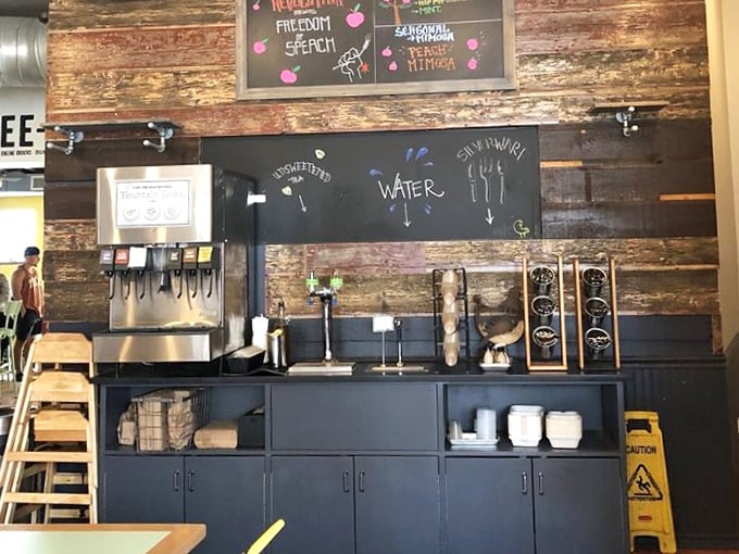 Rustic wood paneling meets modern beverage station—where even the water dispenser gets special treatment with hand-drawn signage.