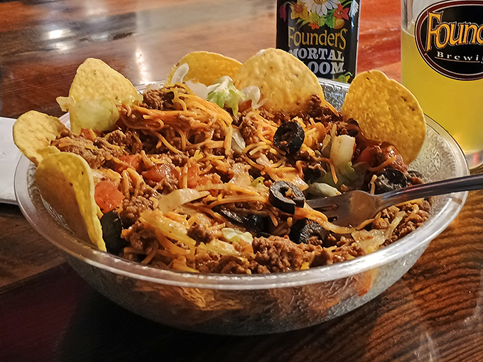 A nacho mountain worth climbing. That fork is attempting what many have tried—conquering this delicious terrain in one sitting.