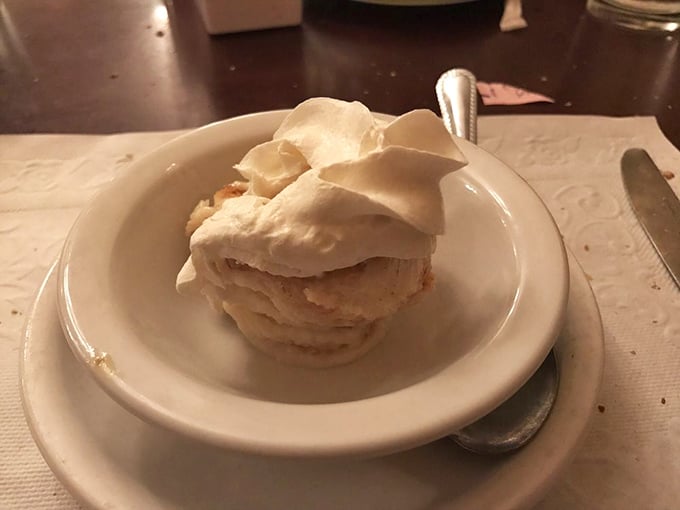 Bread pudding topped with whipped cream – the dessert equivalent of a warm hug from your favorite grandparent.