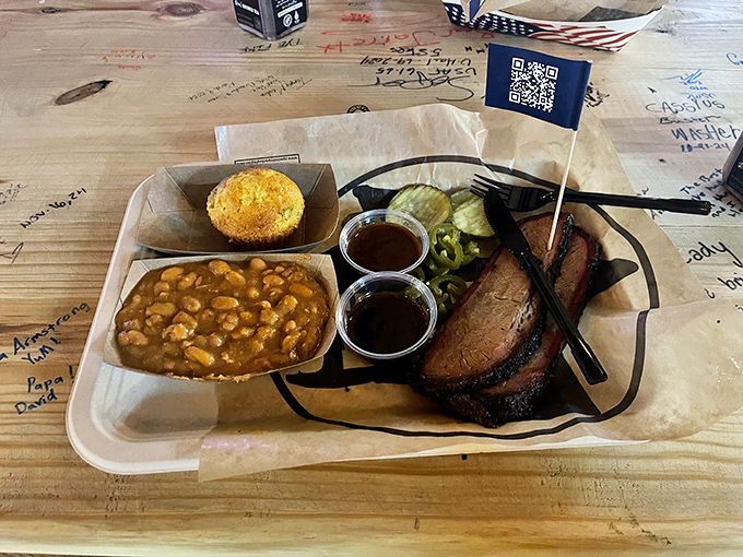 The holy trinity of Texas comfort: brisket, beans, and pickles. Add cornbread and you've got yourself a religious experience.