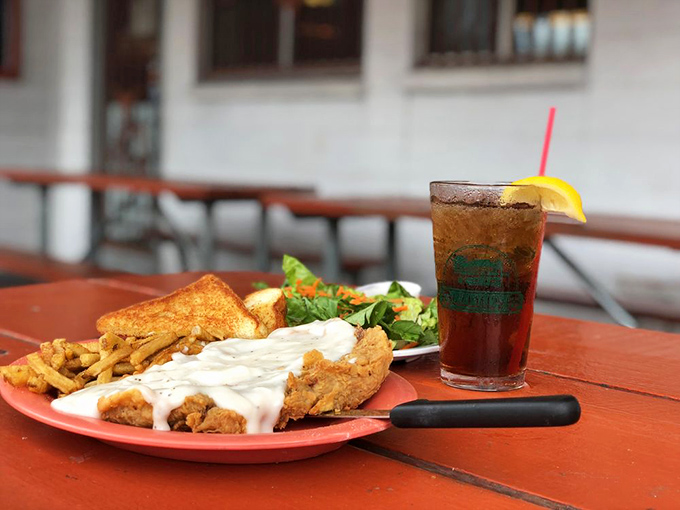 Chicken fried steak smothered in gravy—the dish that's convinced countless vegetarians to "just have one bite" before converting them completely.