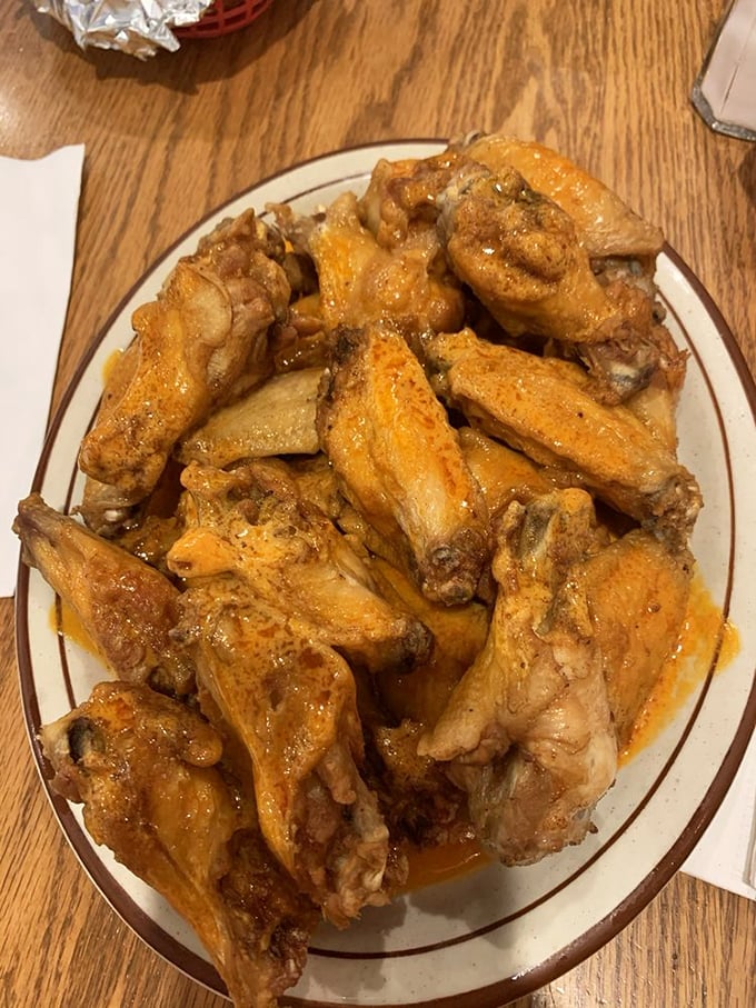 These wings aren't messing around. Meaty, sauce-slicked, and piled high—this is why napkins were invented, folks.