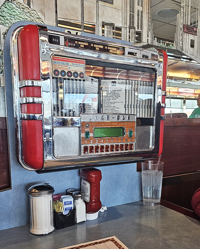 The tabletop jukebox stands ready to provide the soundtrack to your meal – five songs for a dollar and endless diner nostalgia for free.