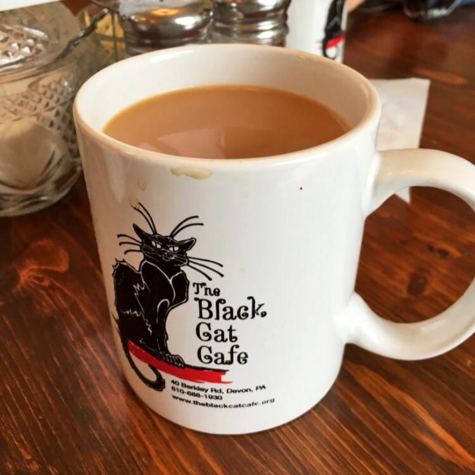 Even their coffee mugs have personality – featuring the cafe's namesake feline looking as satisfied as you'll feel after your meal.