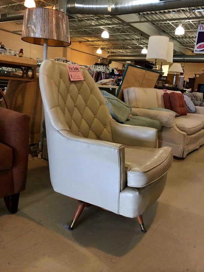 That cream leather chair isn't just furniture—it's a throne from the 1960s waiting for someone to appreciate its retro magnificence.