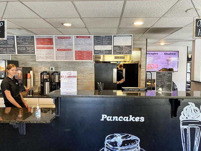 Behind this counter, breakfast dreams come true. The "Pancakes" sign isn't just decoration—it's a delicious promise.