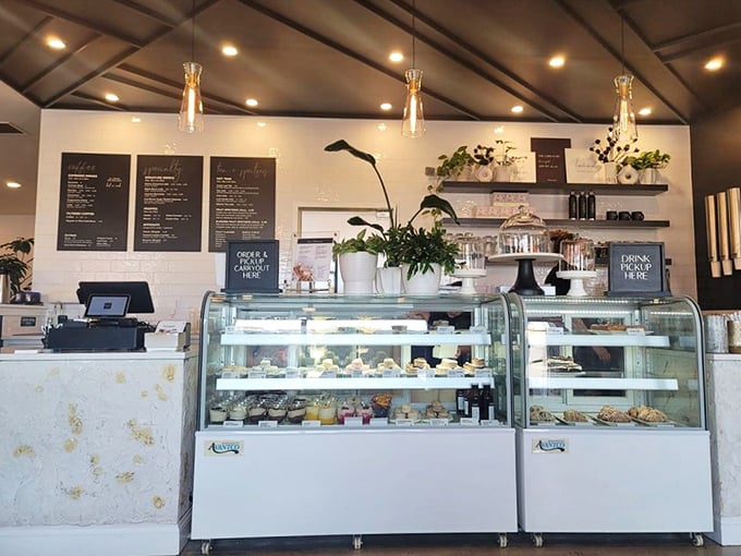 Part café, part bakery, all temptation. Those display cases aren't just storing pastries—they're housing dreams made of butter and sugar.