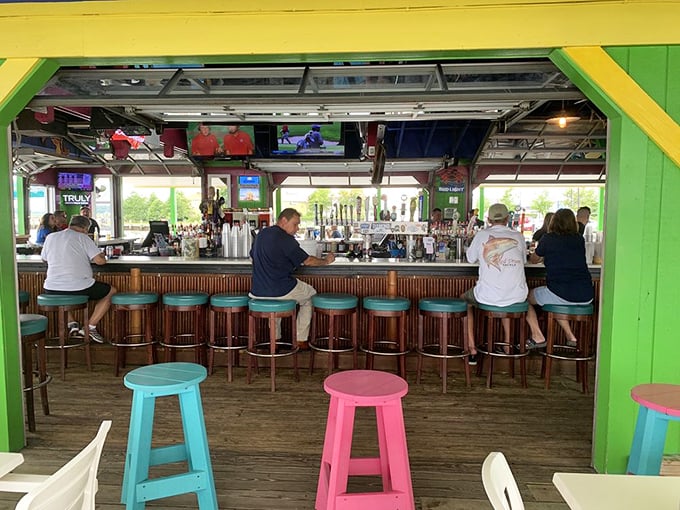 The rainbow of bar stools invites you to pull up, order something cold, and make new friends while watching the game.