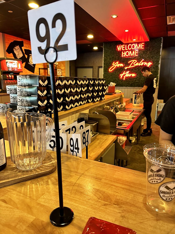 Order numbers stand at attention, ready to call hungry patrons forward for their smoky rewards.