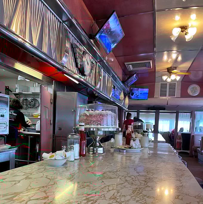 The marble counter gleams under classic lighting fixtures – a stage where breakfast dreams come true one plate at a time.