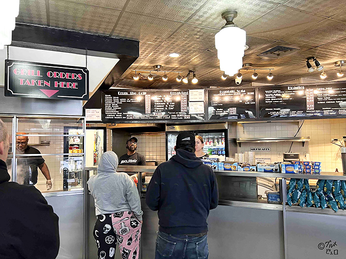 The ordering counter – where dreams and hunger meet. The staff stands ready to transform your cravings into reality.