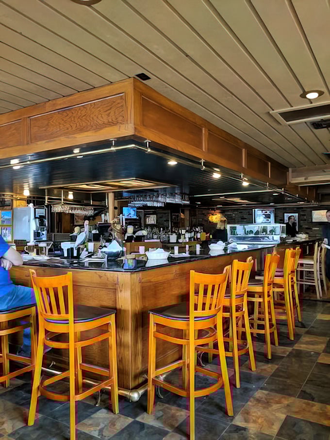 The bar at Smuggler's Cove—where seafood stories get taller and cocktails disappear faster than a submarine on radar.