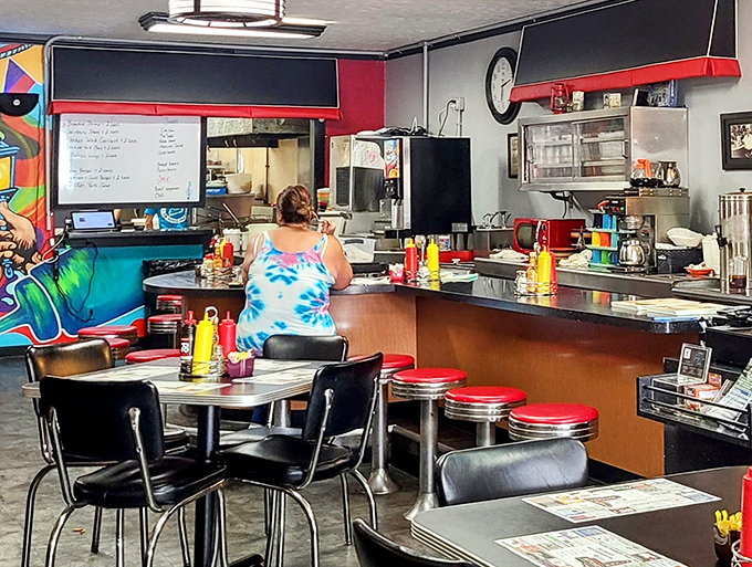 The counter – where coffee cup refills appear like magic and the staff choreographs the breakfast ballet with practiced precision.