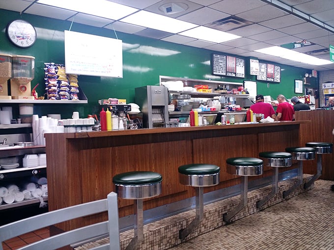 The counter seating—where solo diners become regulars and regulars become family—complete with those spinning stools we all secretly love.
