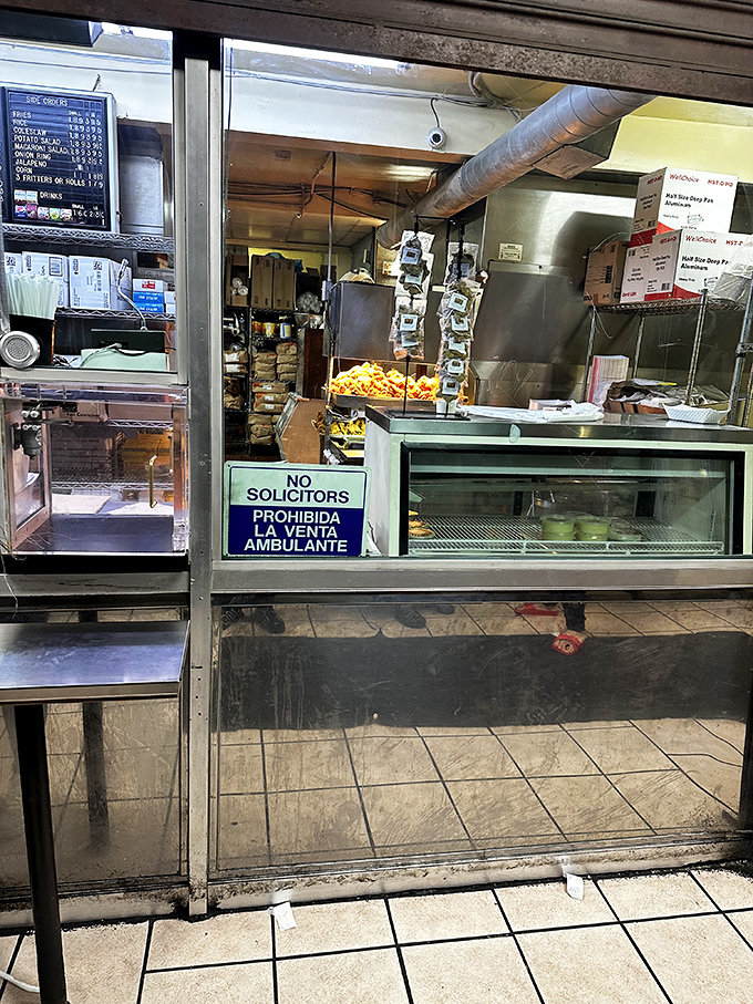 Behind this counter, culinary magic happens daily. No fancy equipment needed—just decades of know-how and dedication to the perfect fry.