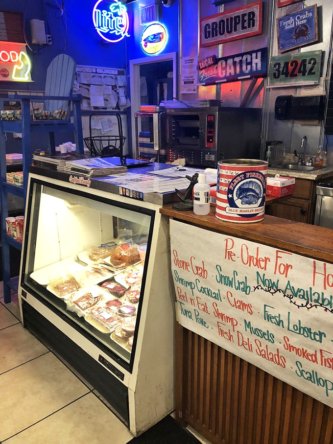 Where the magic happens—fresh seafood on display, neon signs glowing, and the promise of "Local Catch" that wasn't swimming too long ago.