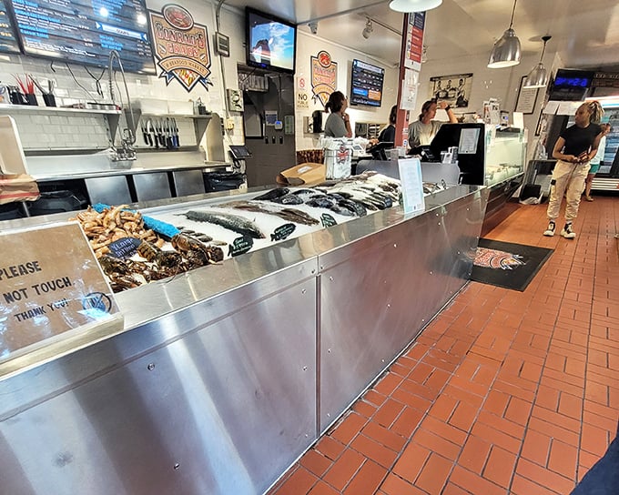 The counter where seafood dreams begin – stainless steel simplicity that lets the star attractions shine without unnecessary frills or distractions.