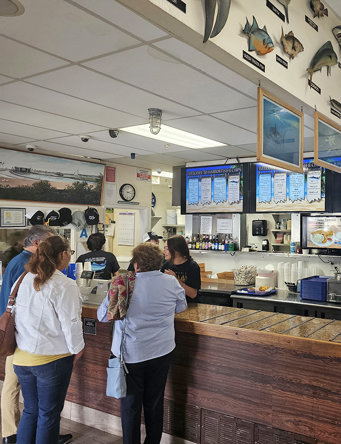 The ordering counter – where dreams of perfectly fried fish begin and diet plans go to die. Worth every delicious calorie!