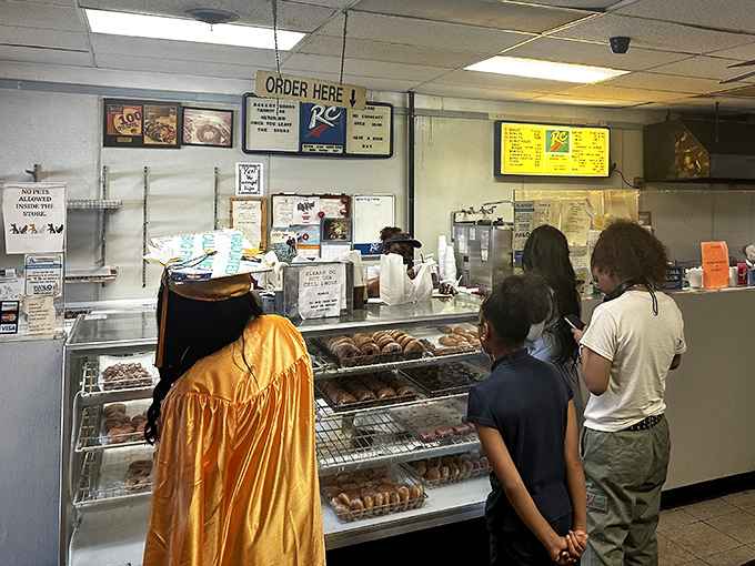 The anticipation in line is part of the experience. These customers know that patience is rewarded with fried dough perfection.