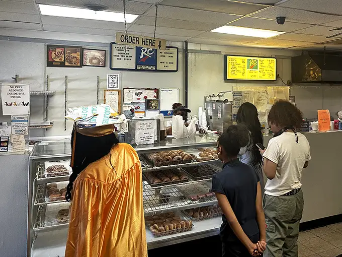 The anticipation in line is part of the experience. These customers know that patience is rewarded with fried dough perfection.