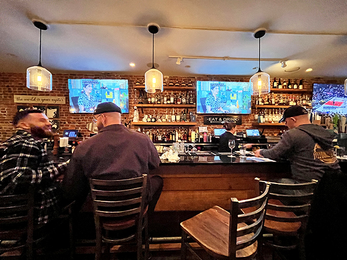 The bar scene – where strangers become friends over oysters and ale, proving that good food is the universal language we all speak fluently.