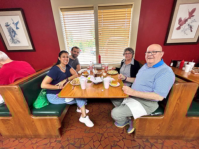 Multi-generational families gathered around tables of barbecue—this isn't just lunch, it's a North Carolina tradition being passed down in real time.