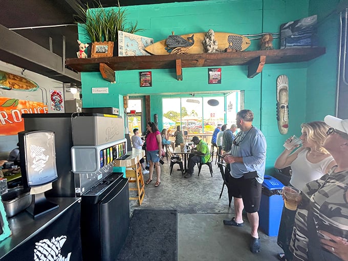 The interior buzzes with anticipation as diners gather in the turquoise-walled taco sanctuary, waiting for their names to be called.