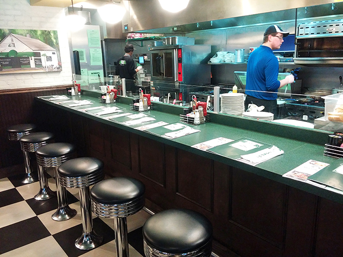 Classic diner counter seating – where solo diners become temporary neighbors and the kitchen's symphony plays just feet away.