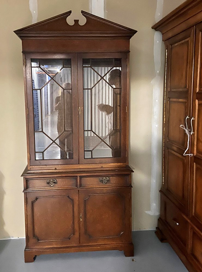 This isn't just a display cabinet—it's an heirloom-in-waiting with the perfect amount of patina to convince guests you inherited it from a sophisticated aunt.