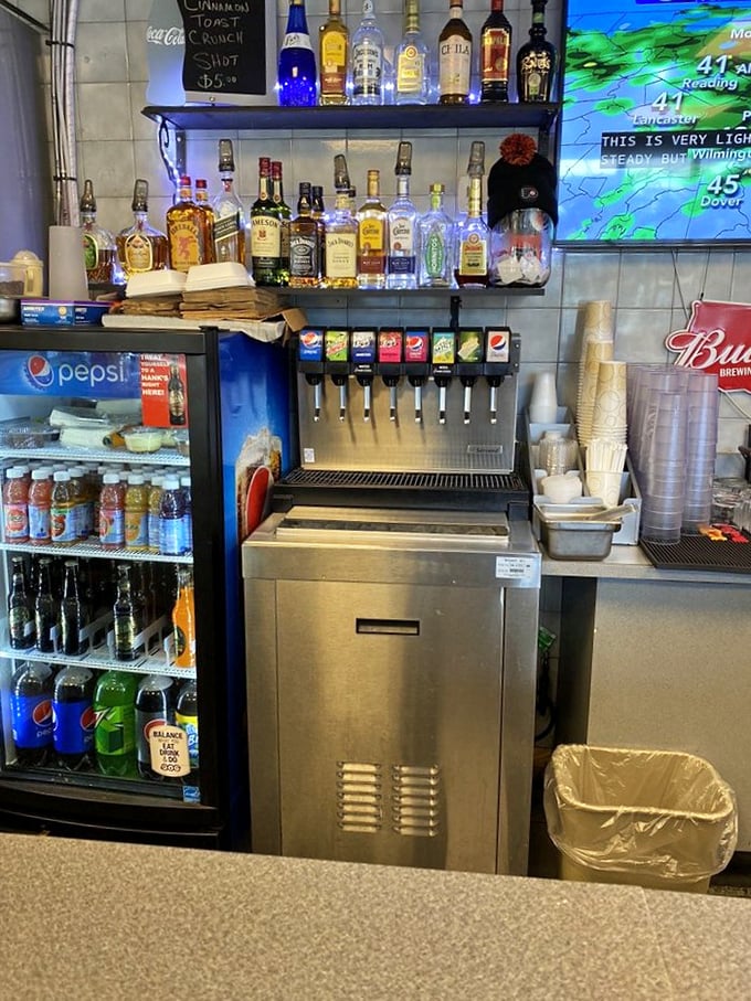 The drink station stands ready to quench your thirst after that pepper-laden sandwich. Hydration is key to professional cheesesteak eating.