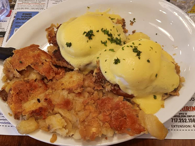 Eggs Benedict that would make a brunch enthusiast weep – perfectly poached eggs, rich hollandaise, and crispy potatoes that refuse to be ignored.