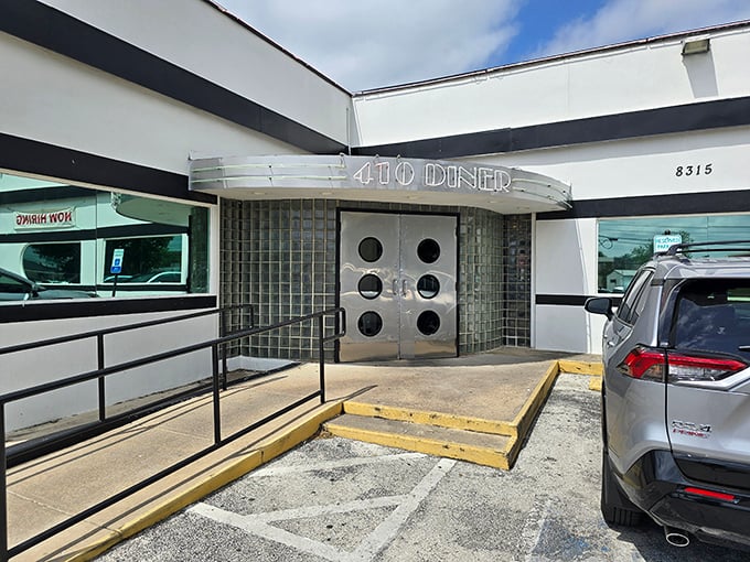 Those silver double doors might as well be a portal to simpler times, when diners were the original social networks.