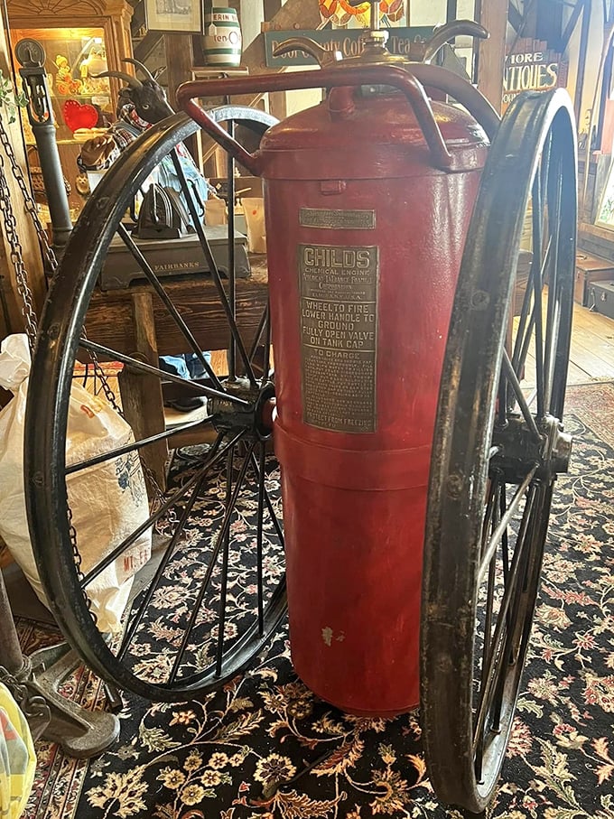 A Childs fire extinguisher on wheels—firefighting technology from when "rapid response" meant "as fast as we can roll this thing." P